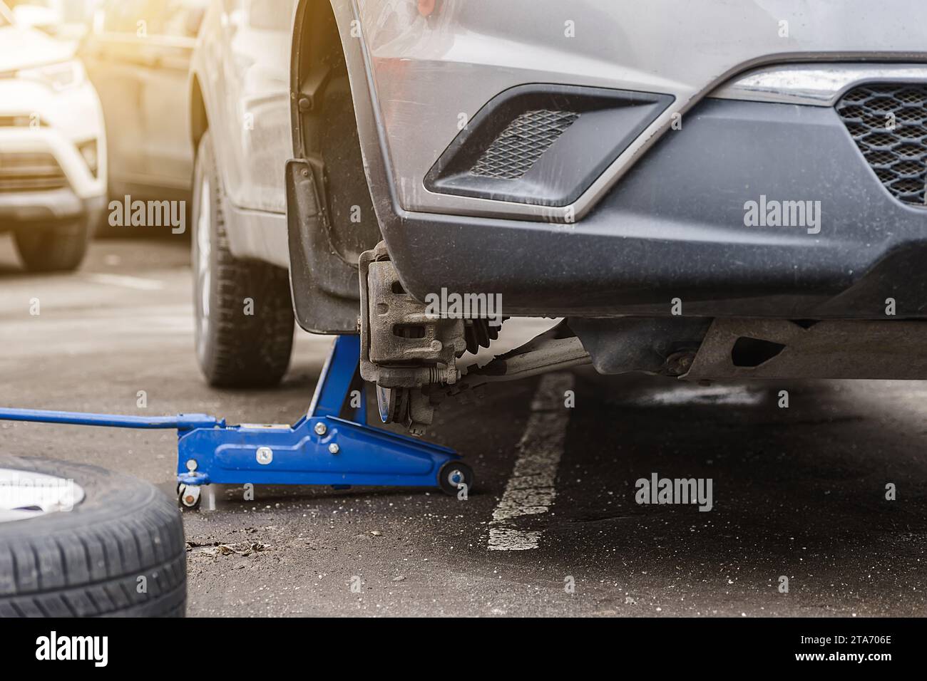 Car wheel replacement. Self-service tire fitting concept. Installing a ...