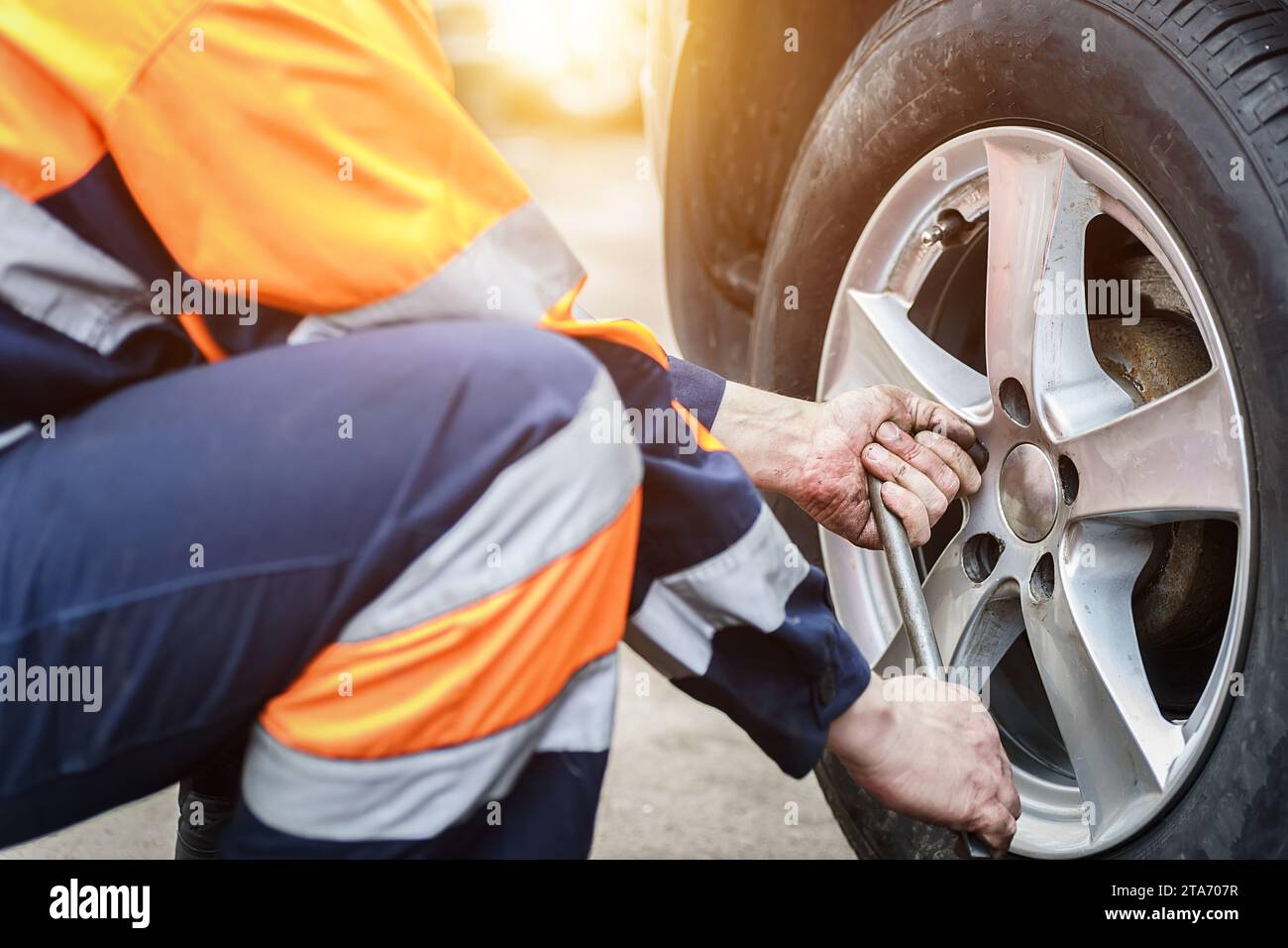 Car wheel replacement. Self-service tire fitting concept. Installing a ...