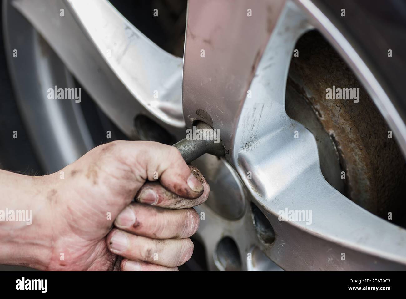 Car wheel replacement. Self-service tire fitting concept. Installing a ...