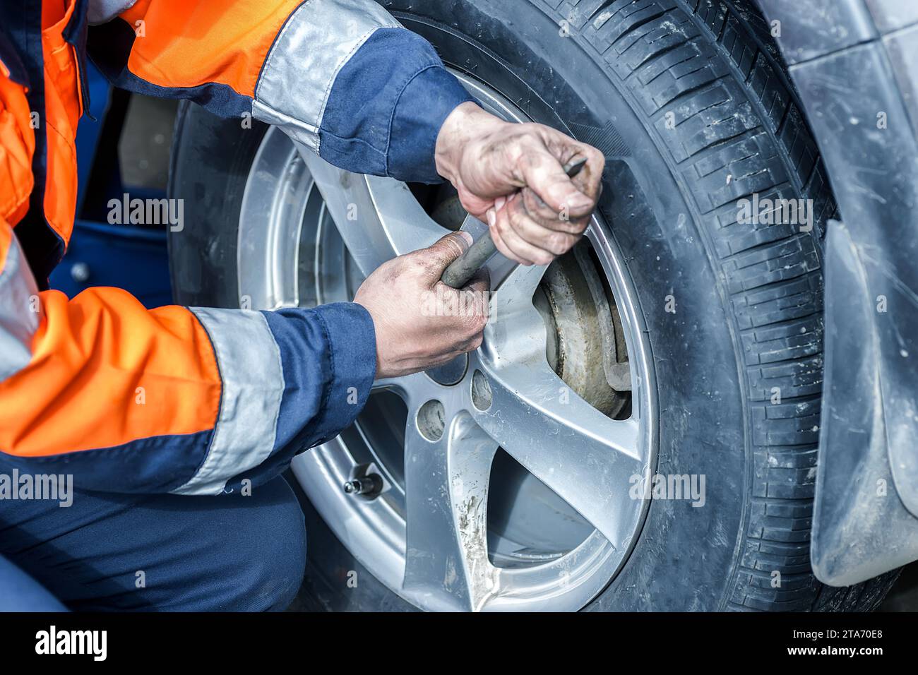 Car wheel replacement. Self-service tire fitting concept. Installing a ...