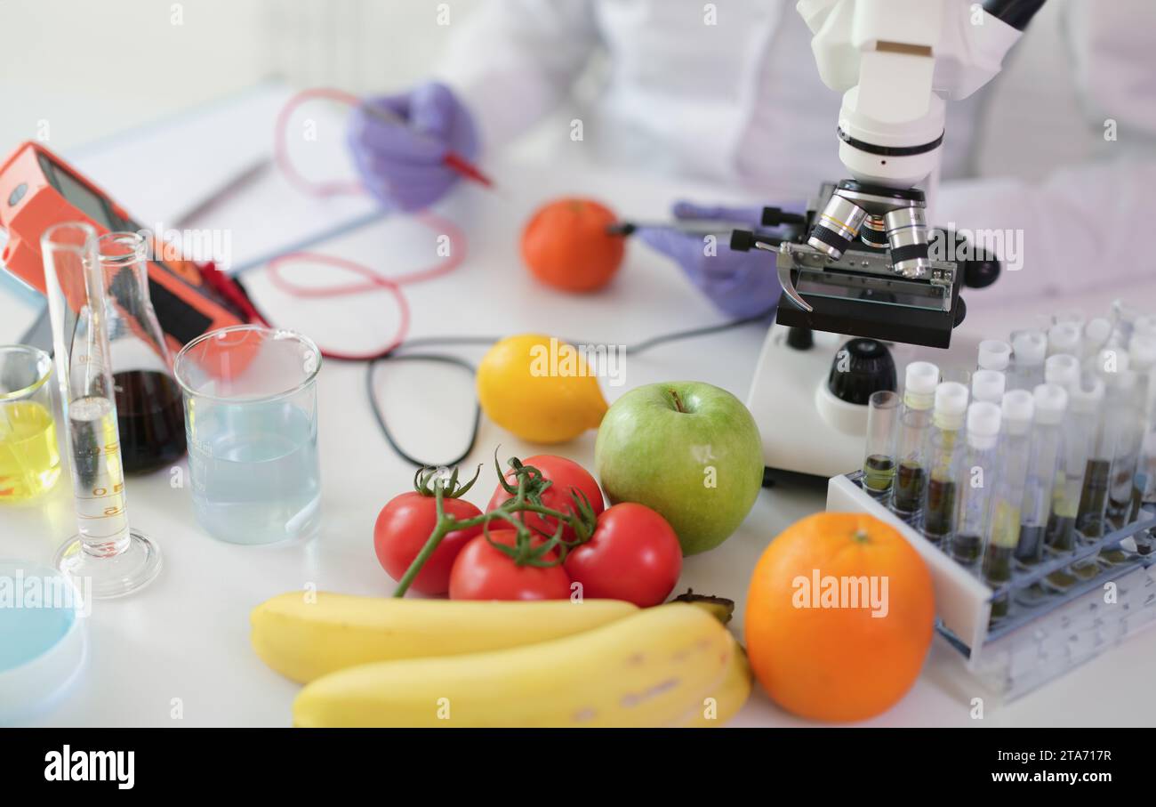 Scientist chemist studying amount of toxic substances in vegetables and ...