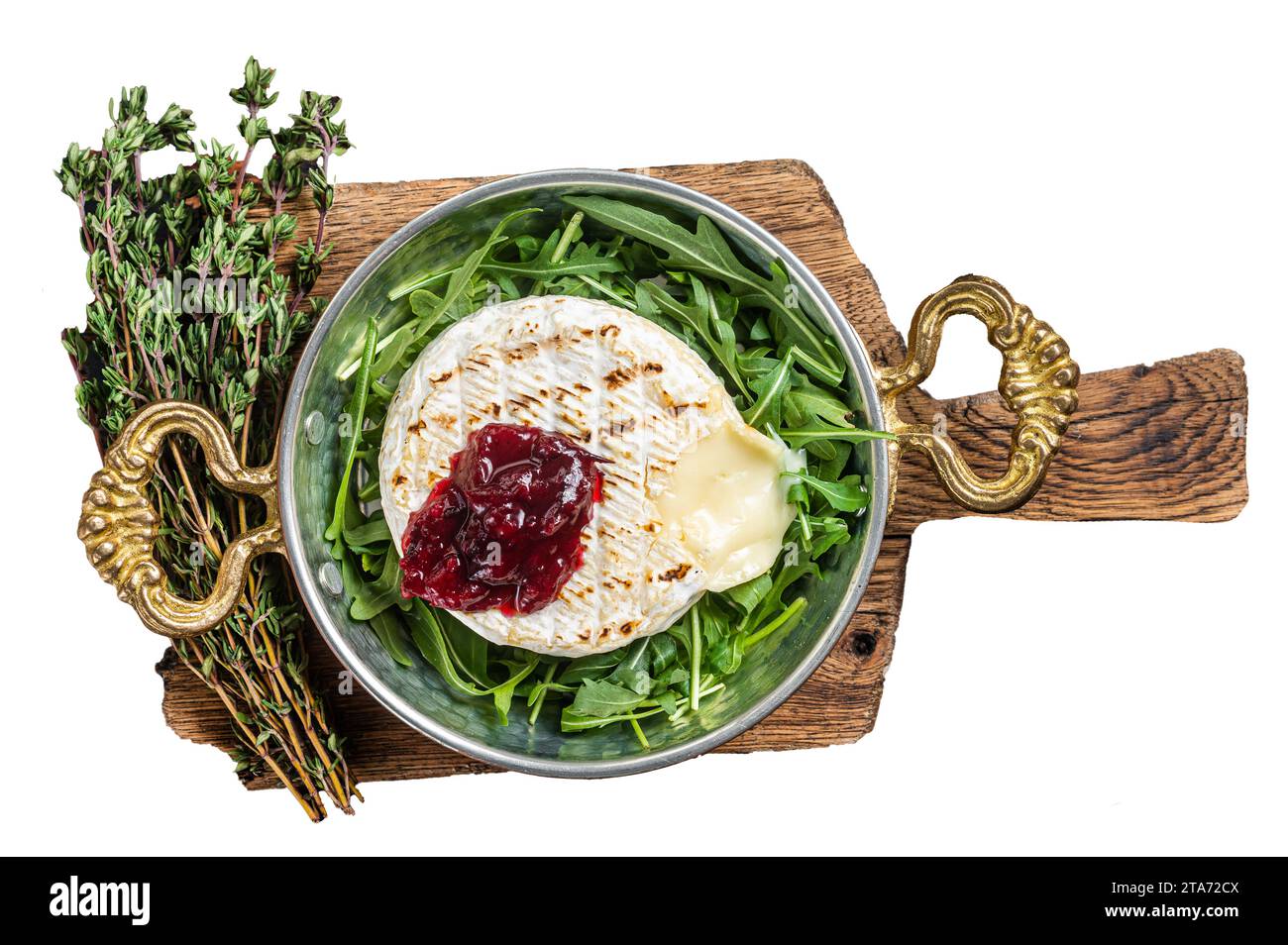 Baked Camembert Brie cheese with a cranberry sauce and garnished with ...