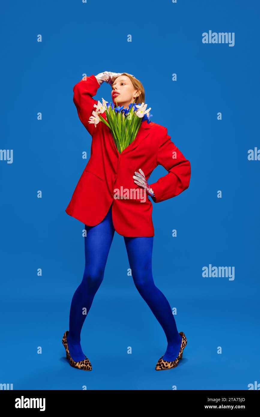 Glamorous young woman with makeup. Weird girl with flowers in unusual ...