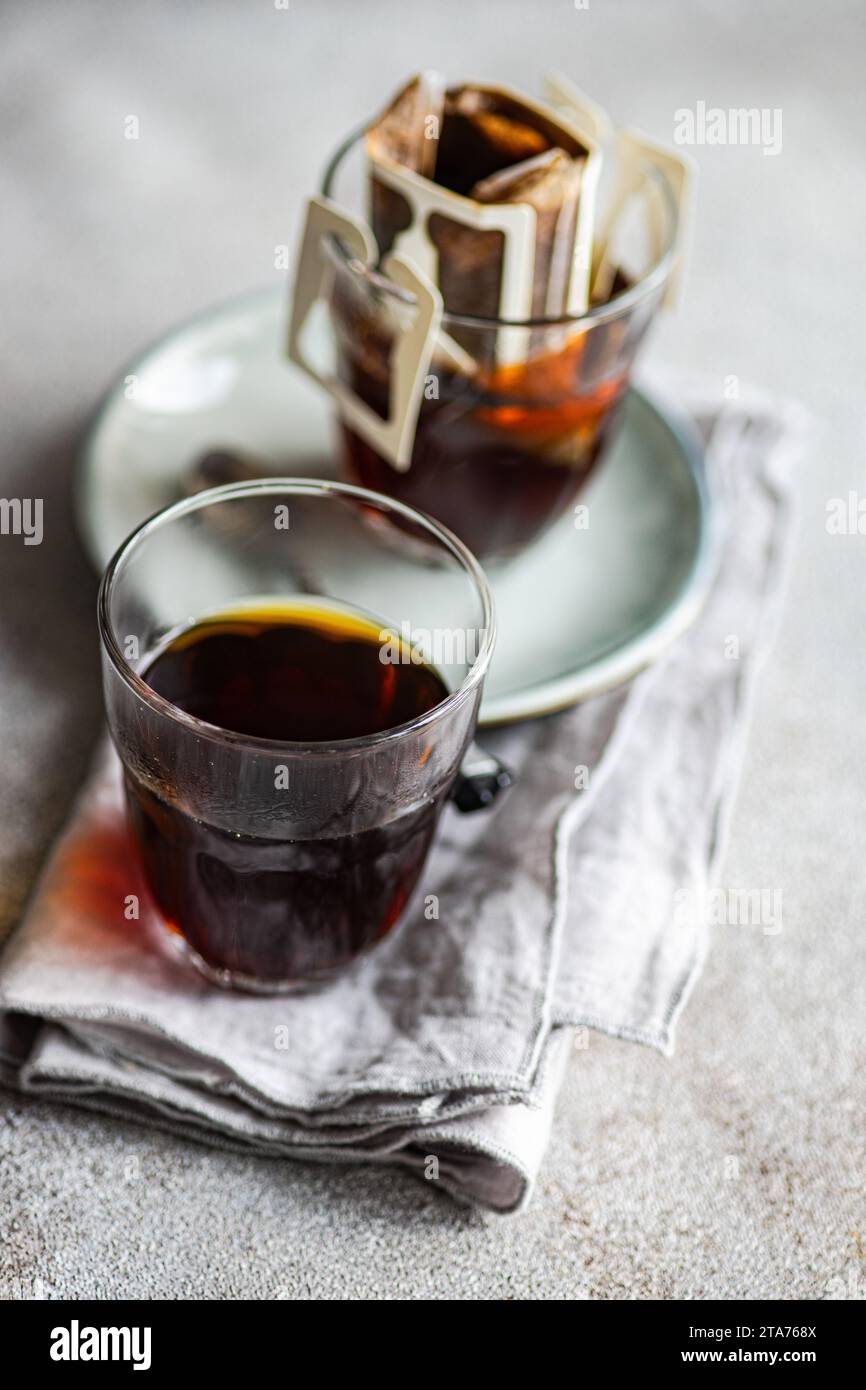 Two individual cups of coffee brewing in glasses Stock Photo - Alamy