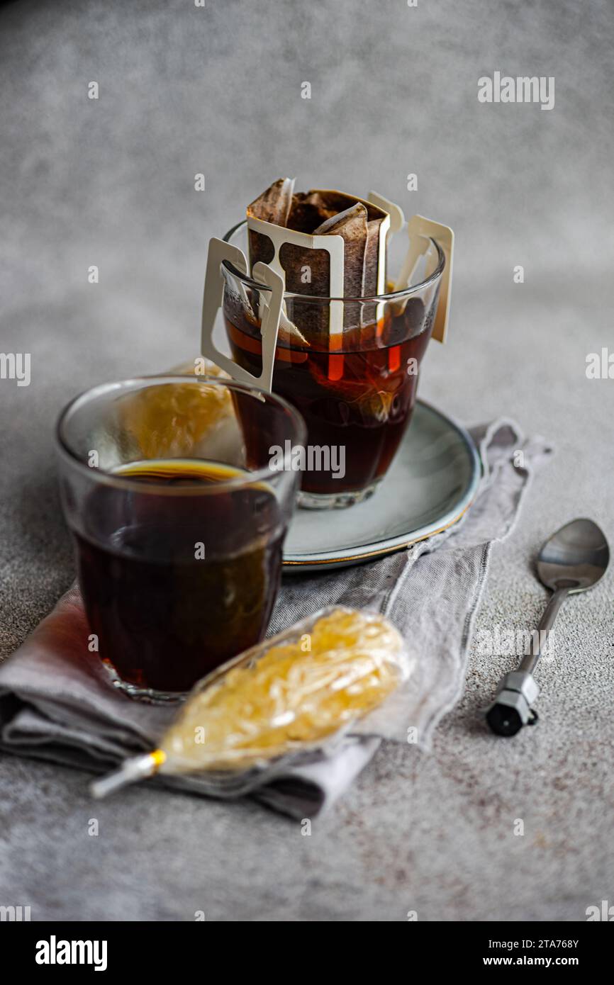 Two individual cups of coffee brewing in glasses Stock Photo - Alamy