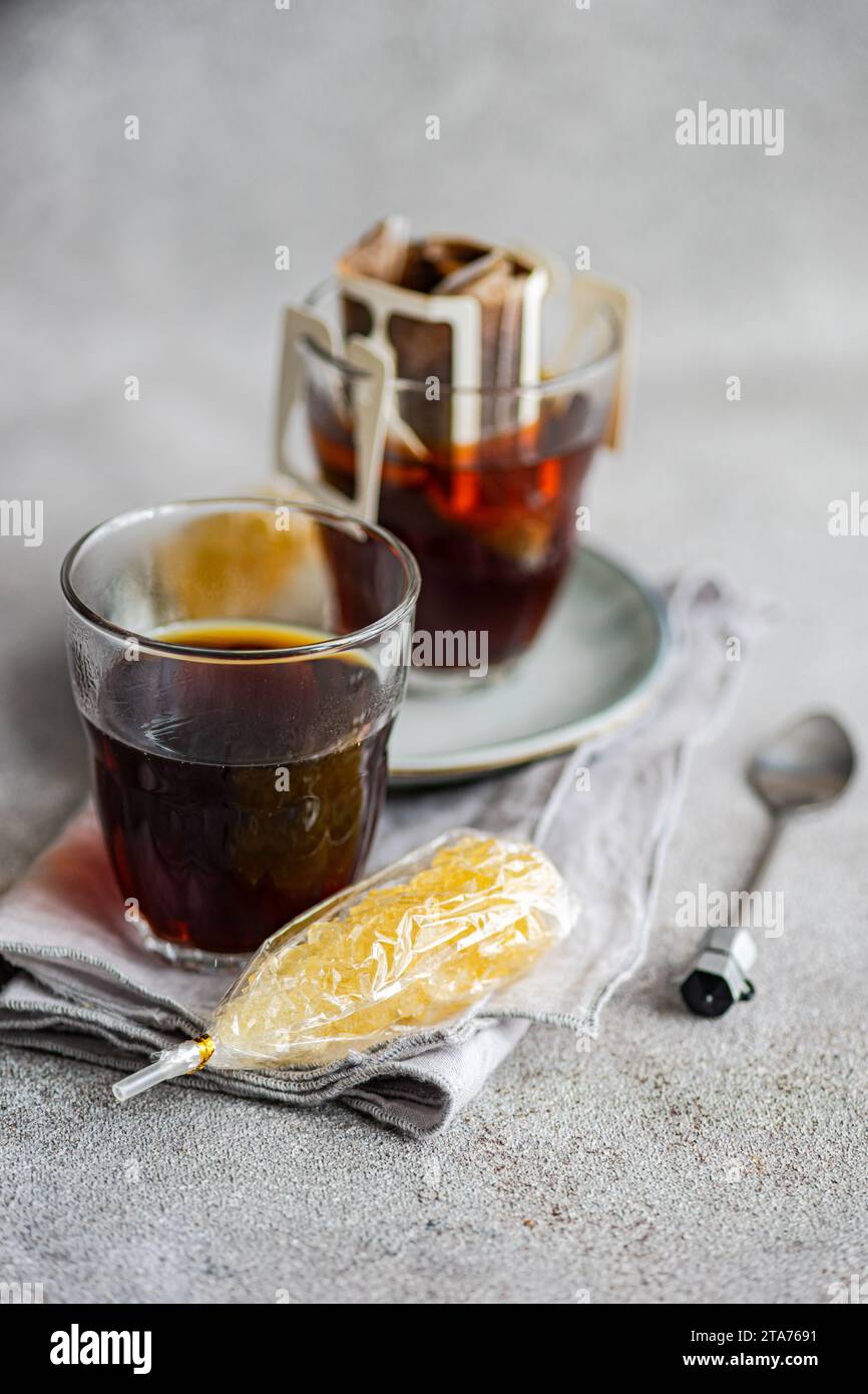 Two individual cups of coffee brewing in glasses Stock Photo - Alamy