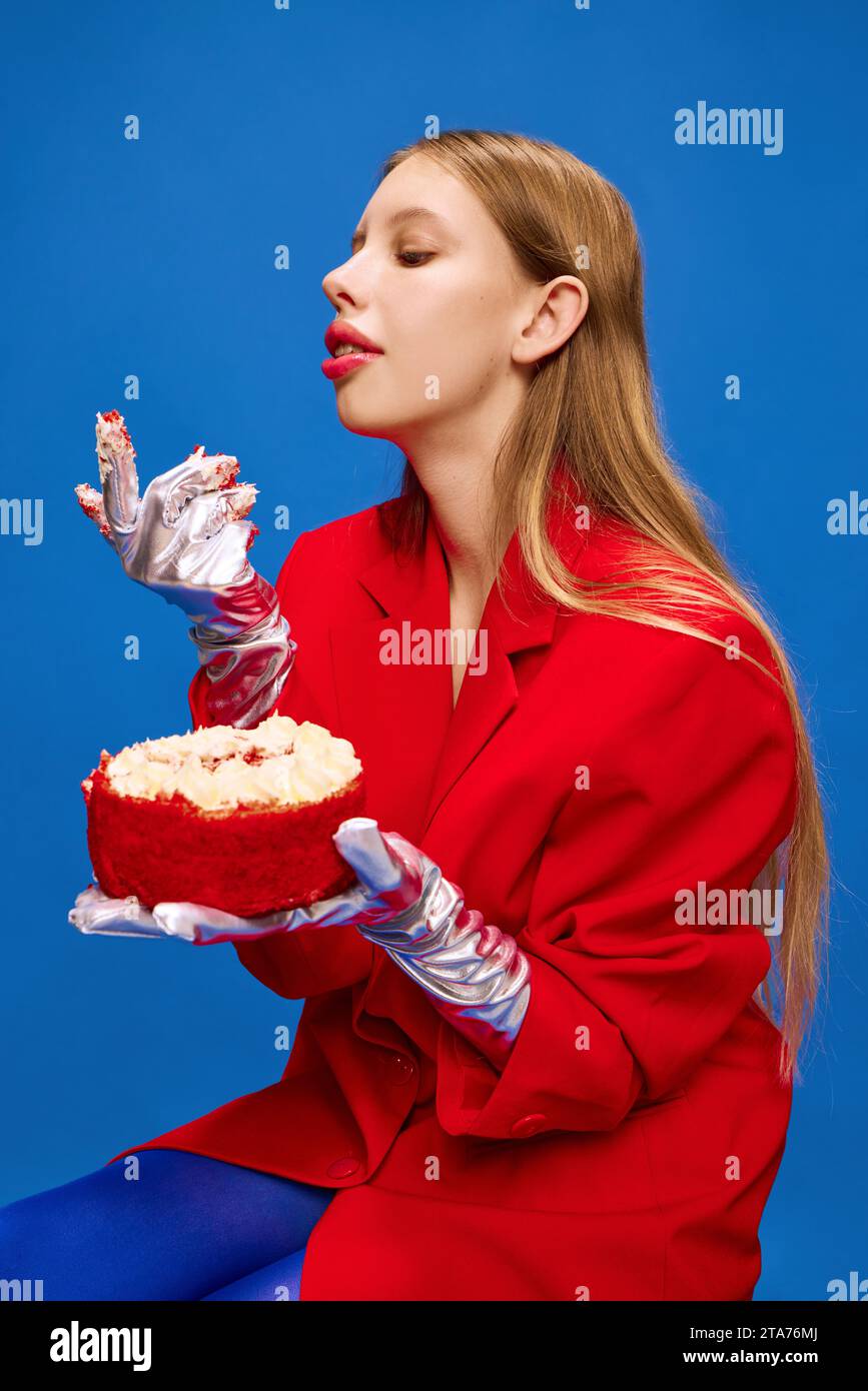 Portrait of overjoyed, freaky, unusual, vivid dressed girl sitting and ...