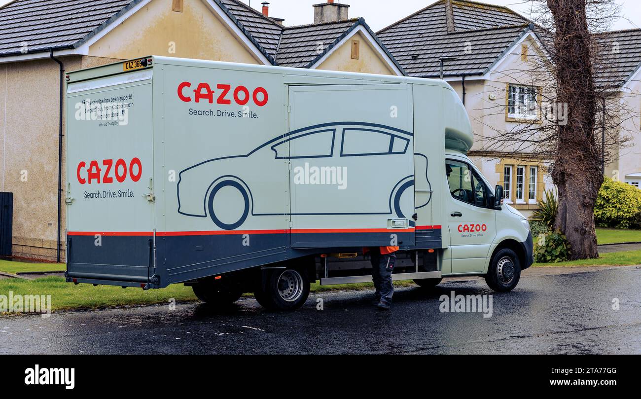 Single black SUV car being delivered to a private home address by a ...