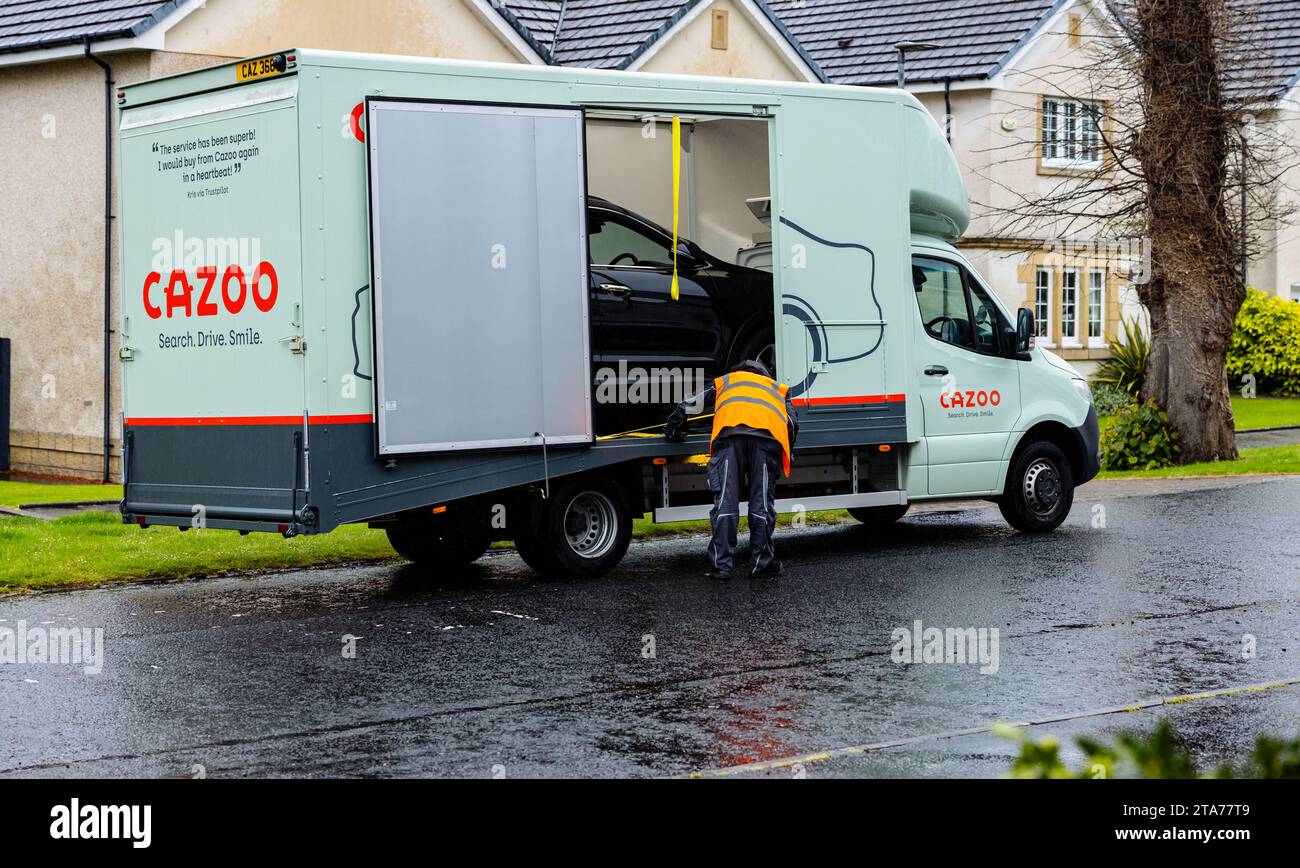 Single black SUV car being delivered to a private home address by a ...