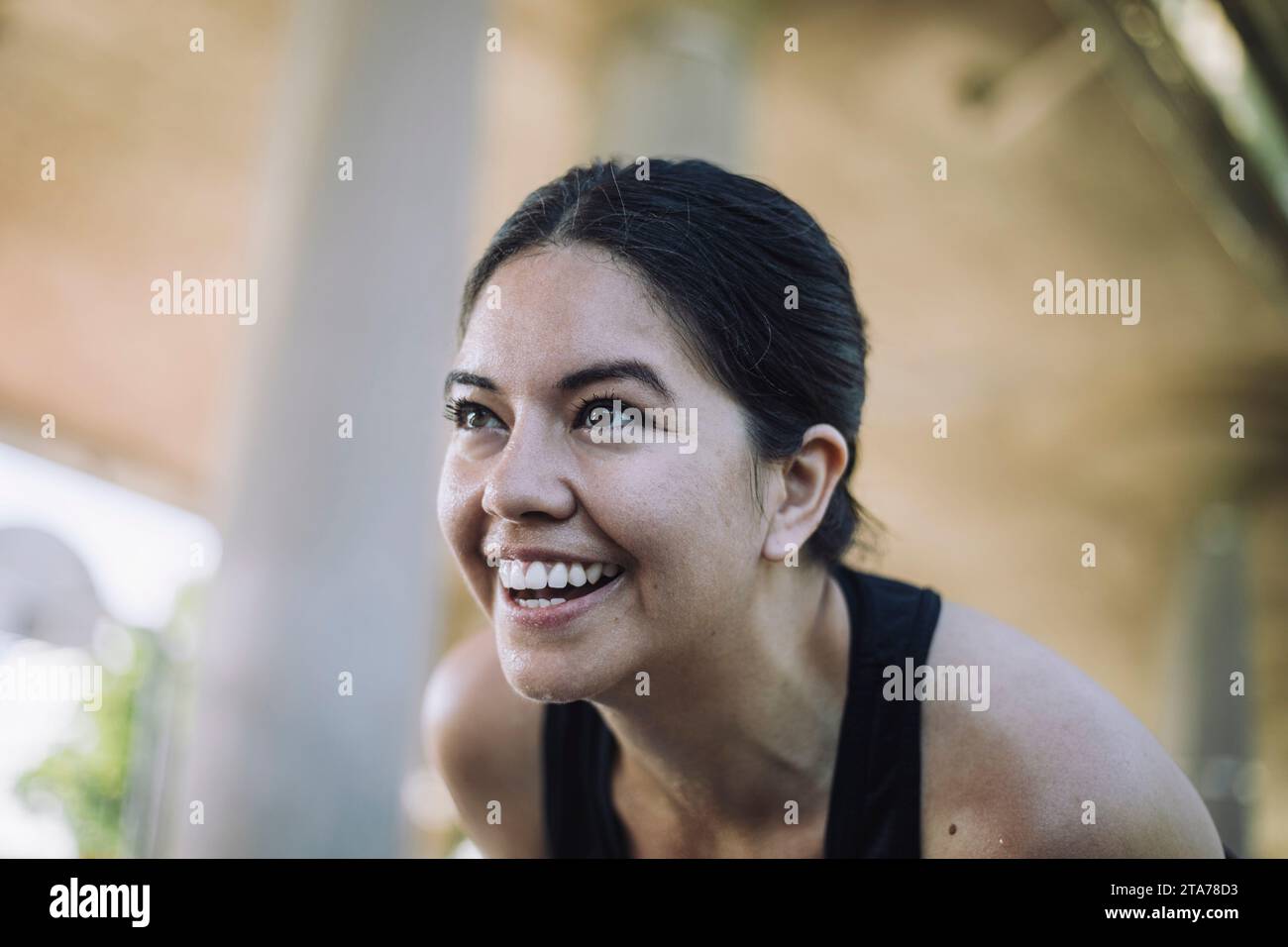 Happy woman laughing while exercising Stock Photo - Alamy