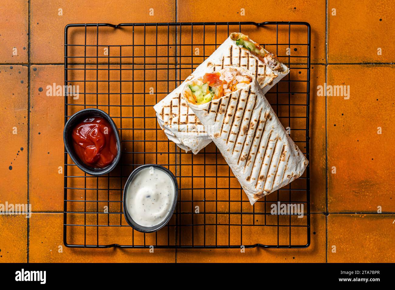 Shawarma durum doner kebab with meat and vegetable salad. Orange ...