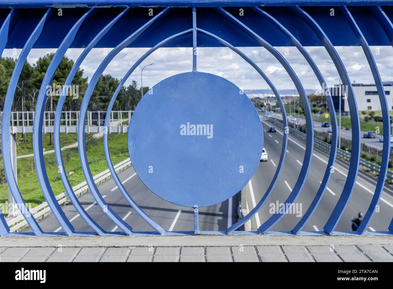 A metal railing with a peculiar structure painted blue Stock Photo - Alamy