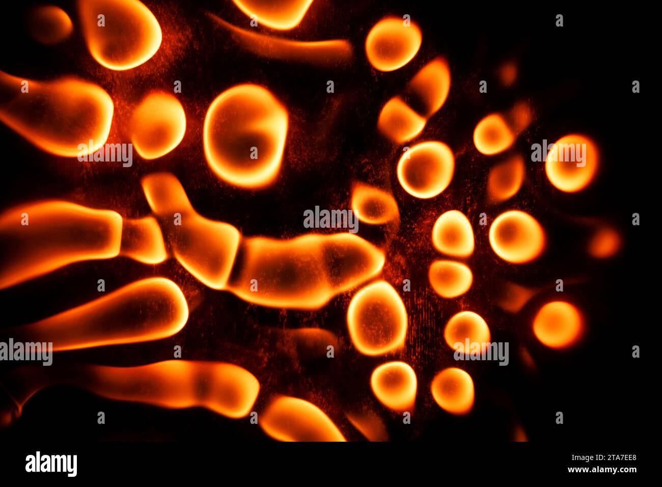 Beautiful liquid red, orange fire texture on black background. Fire in ...
