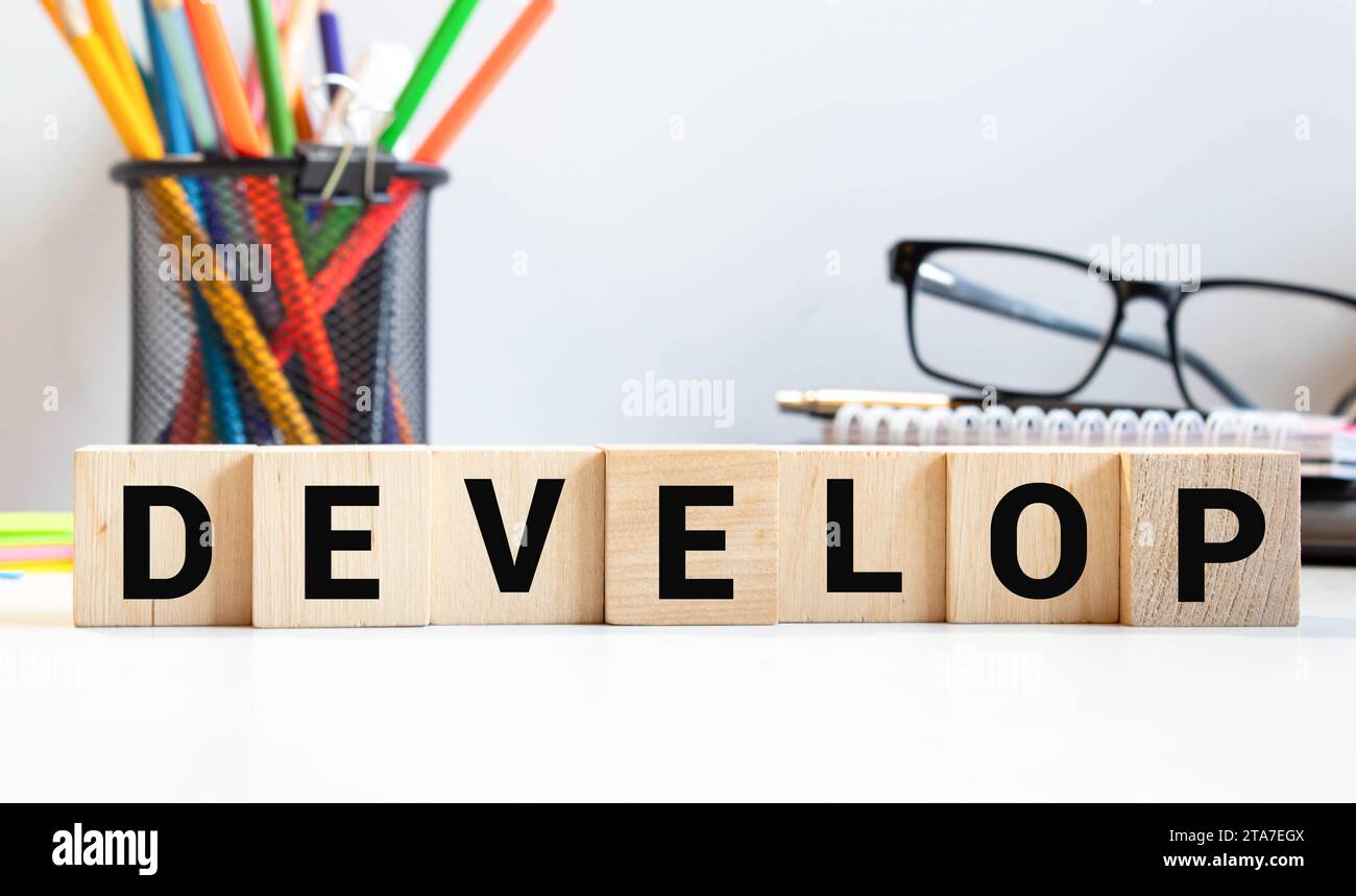 Develop word written on wood block. Develop text on cement table for ...