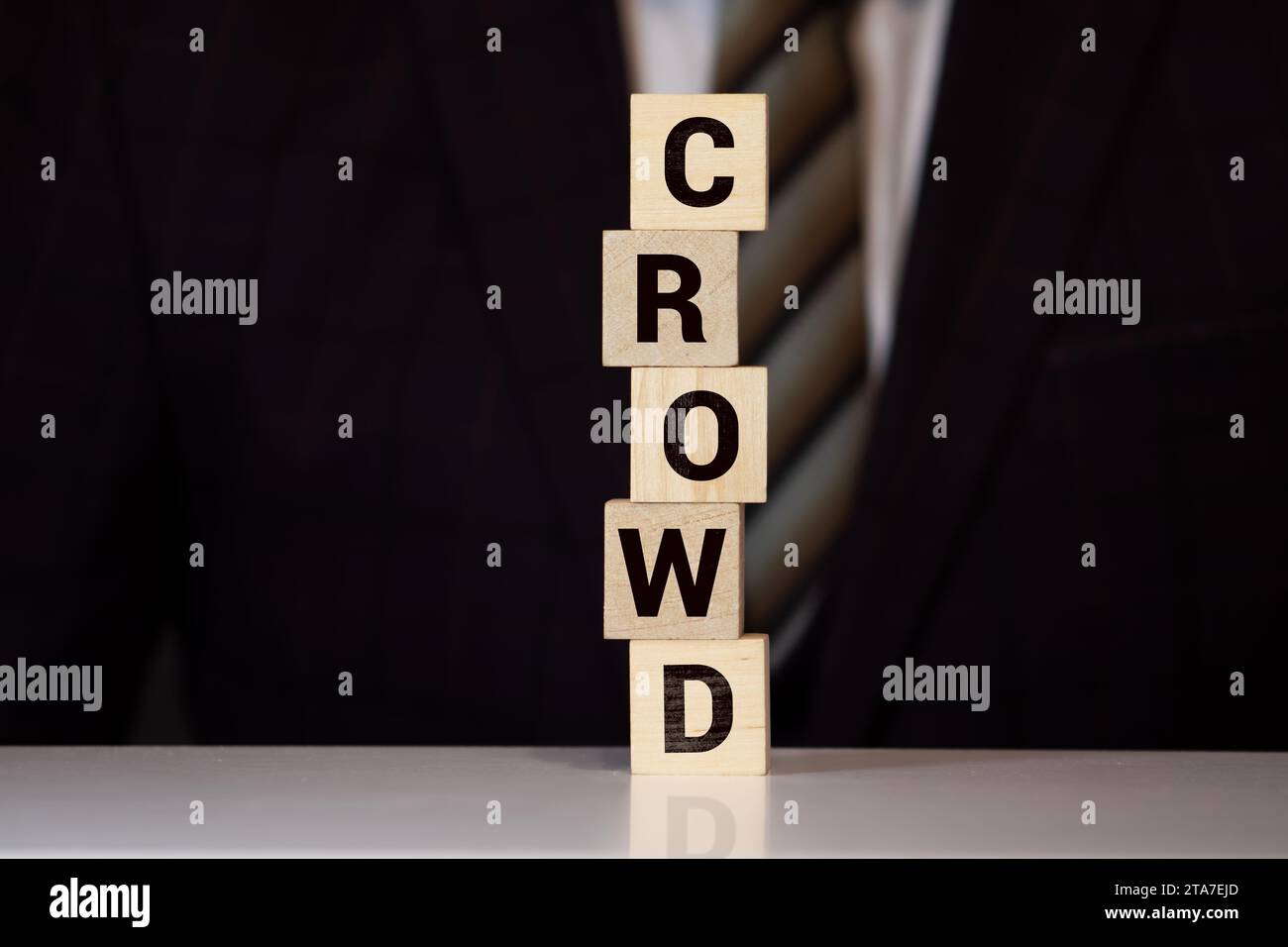 word crowd made from wooden letters lies on a yellow table Stock Photo ...