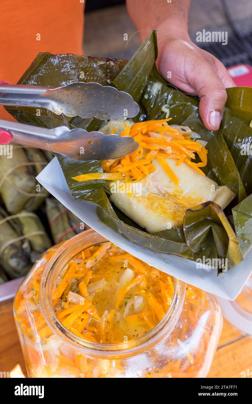 Serving tamales at a market stall in Costa Rica Stock Photo - Alamy