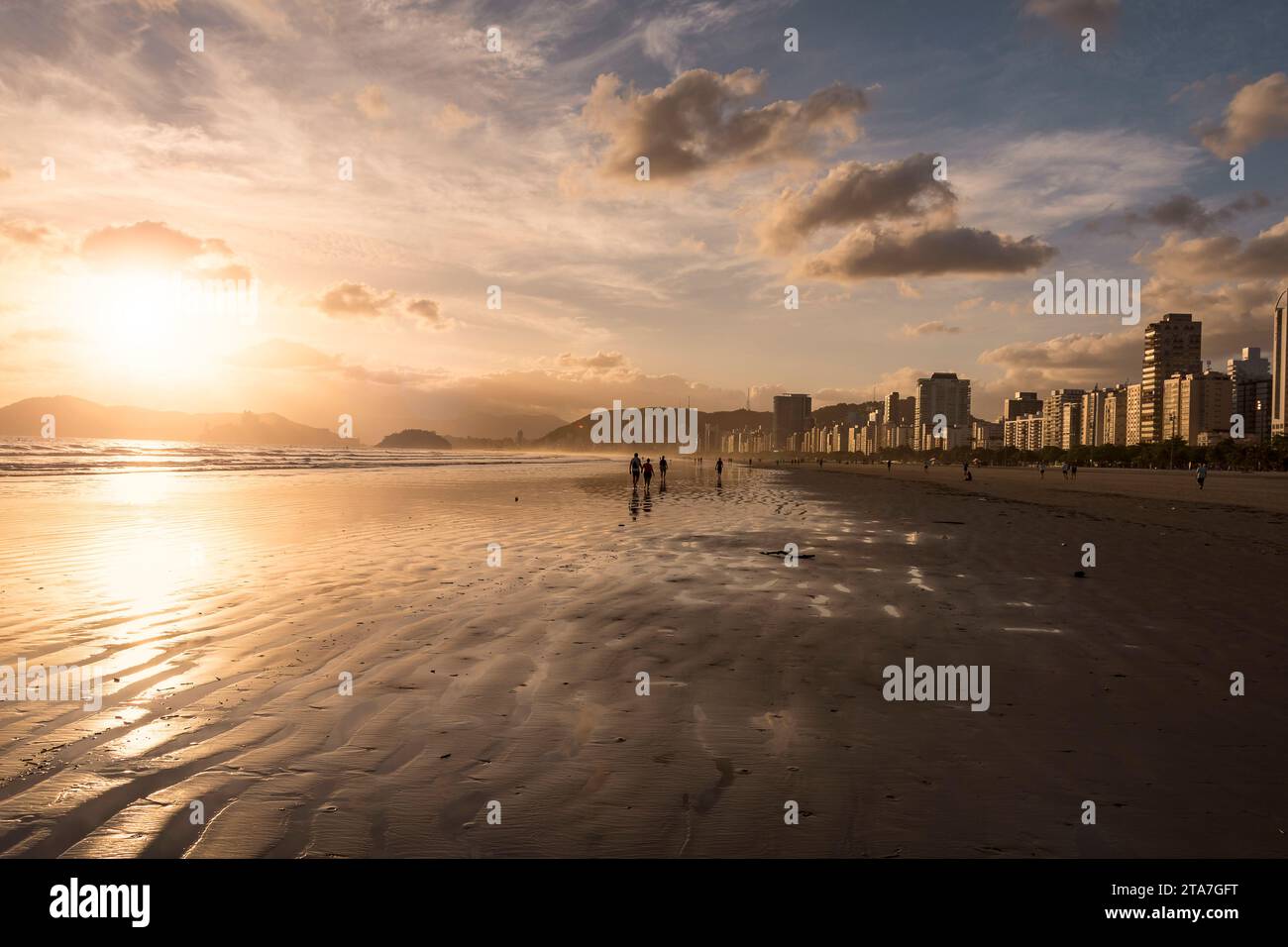 Santos city, Brazil. Sunset at Santos beach with waterfront buildings ...