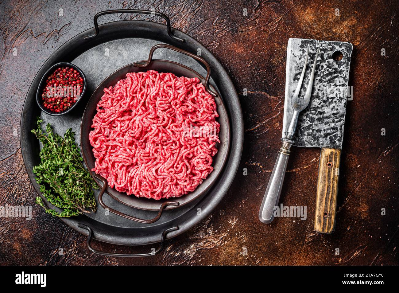 Raw Mince, minced Ground beef meat in a kitchen tray. Dark background ...