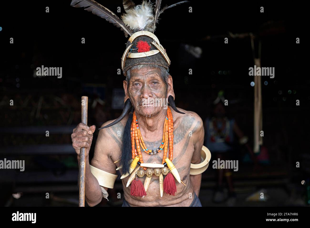 Elder from indigenous Konyak tribe in traditional clothes with ...