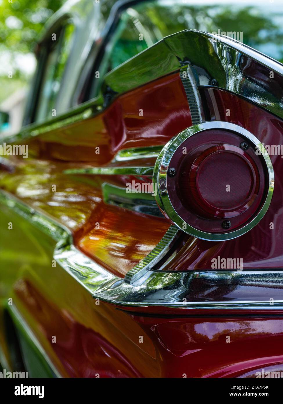 The back of a retro car from the 60s. Rear wing tail unit of red color ...
