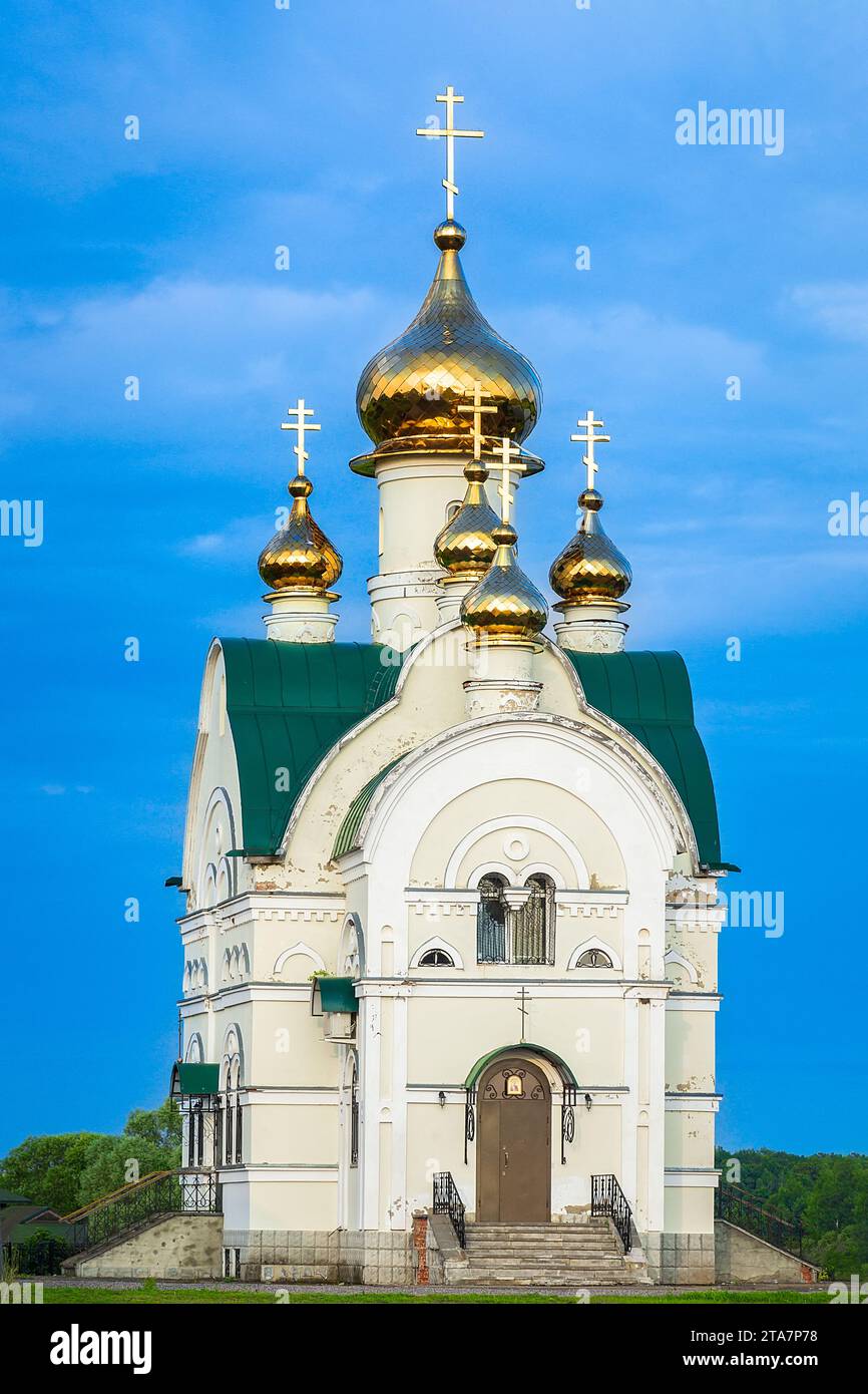 beautiful landscape with a church in summer on a blue sky background ...