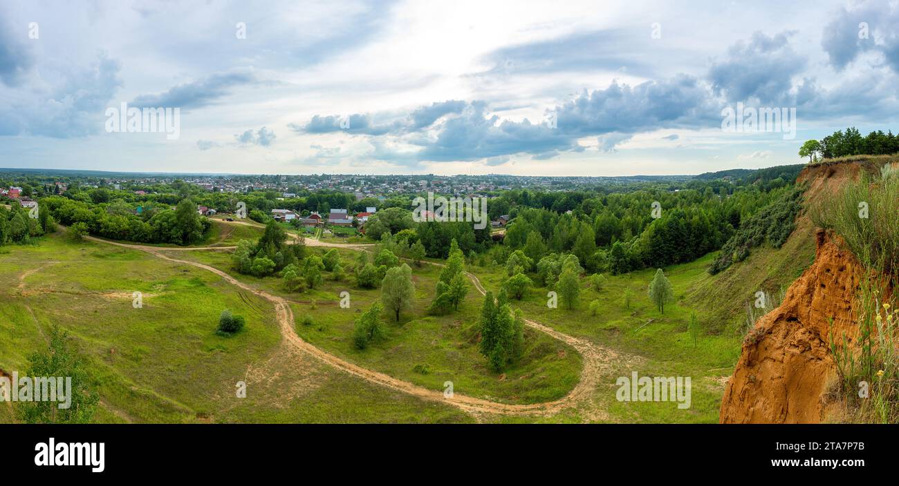 Distant hills. Hilly steppe. Surry hills. Blue sky and grass. Beautiful ...