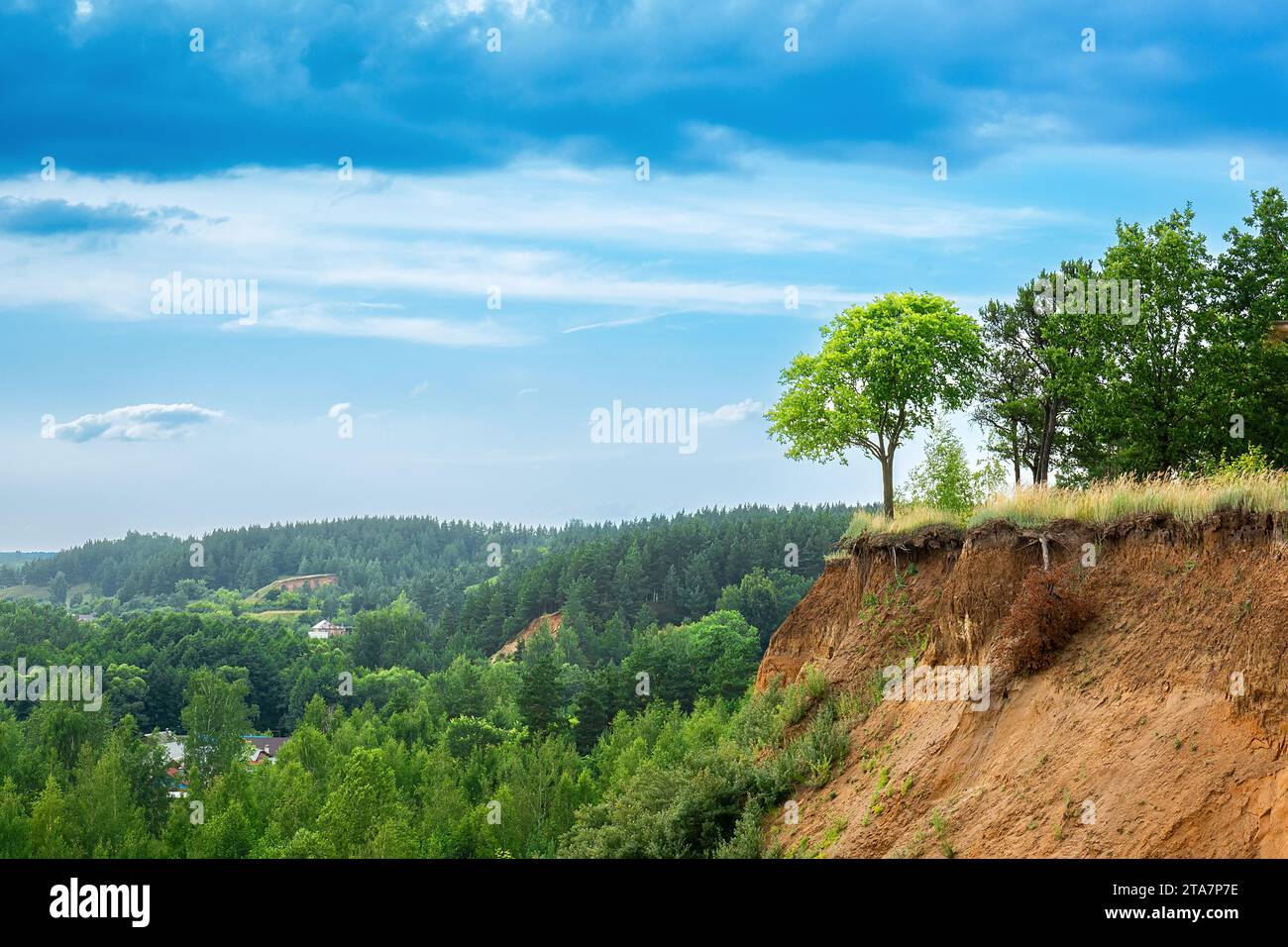 Distant hills. Hilly steppe. Surry hills. Blue sky and grass. Beautiful ...