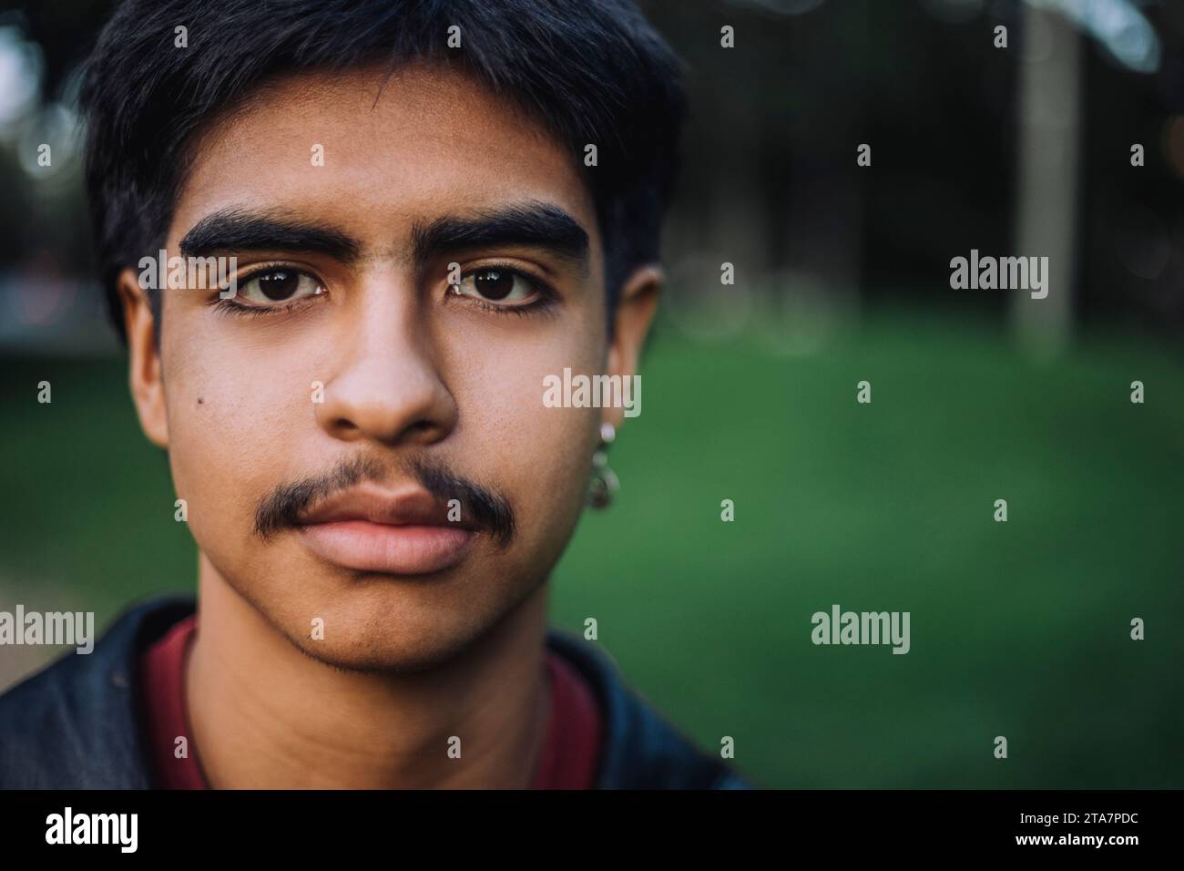 Portrait of serious teenage boy with mustache Stock Photo - Alamy