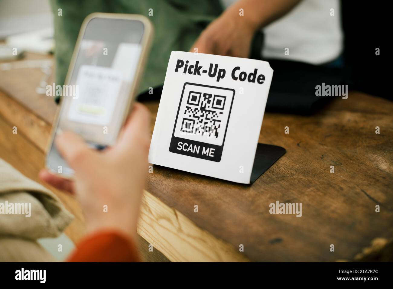 Hand woman woman scanning QR code through smart phone while doing ...
