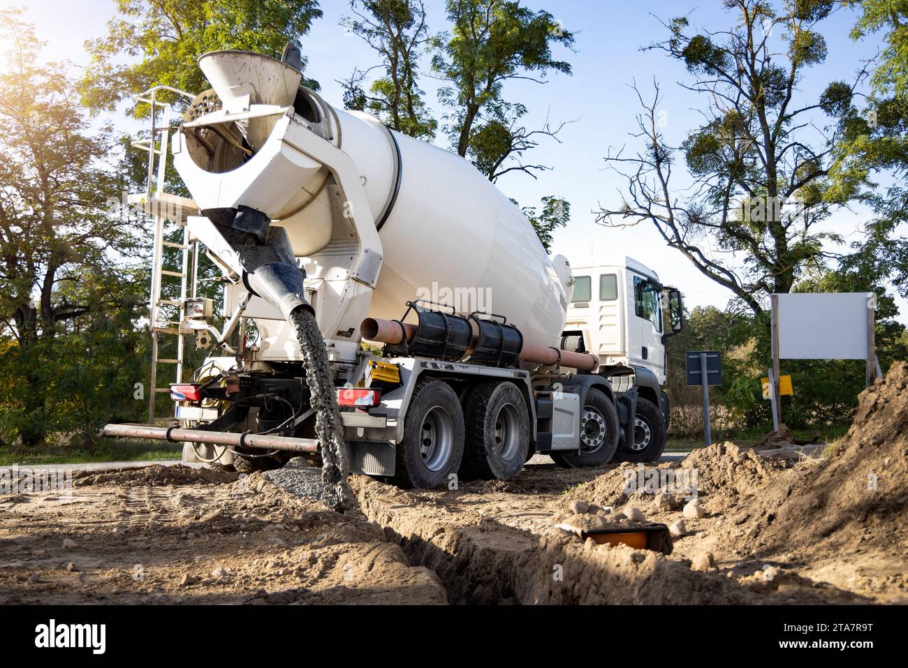 Concrete Mixer Truck Pouring Concrete on a Construction Site Stock ...
