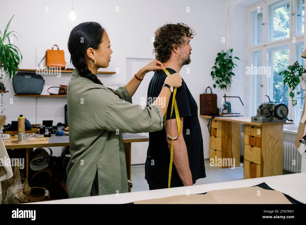 Female fashion designer taking measure hi-res stock photography and ...