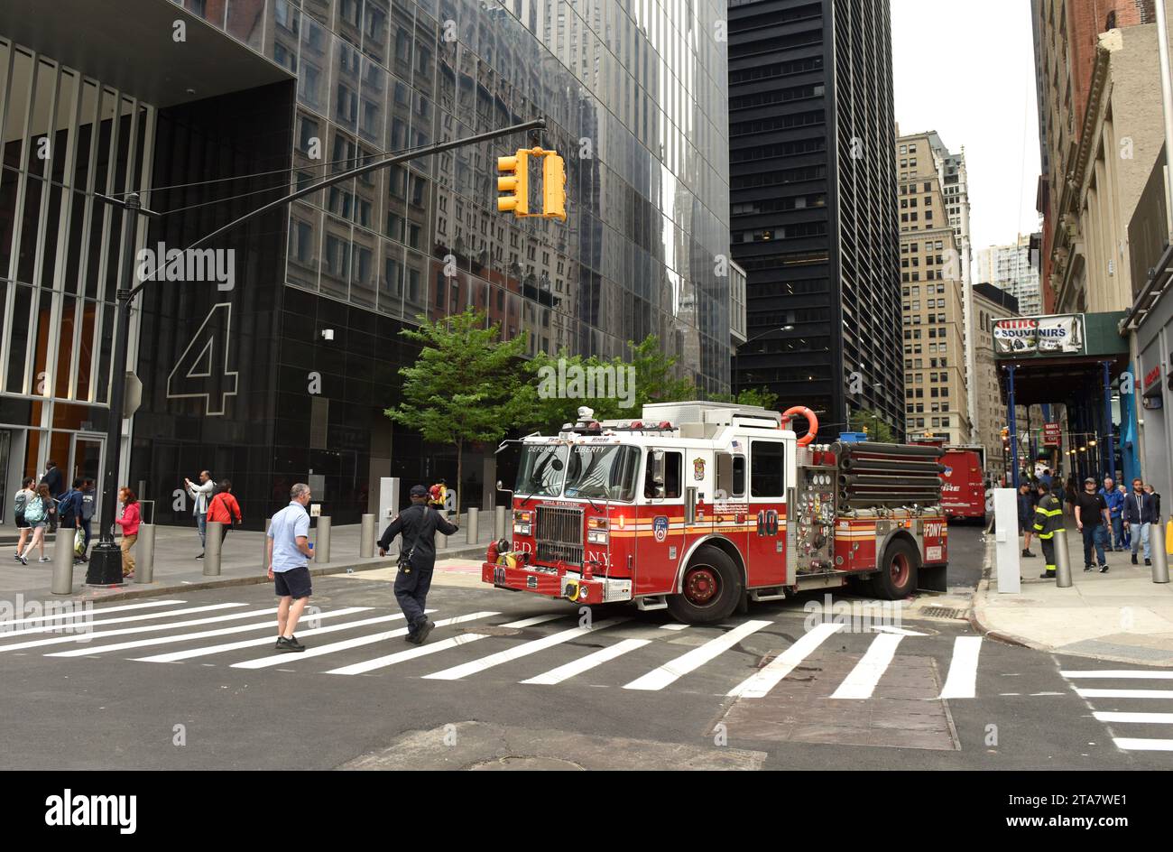 New York, USA - June 10, 2018: Firefighters and fire truck near the ...