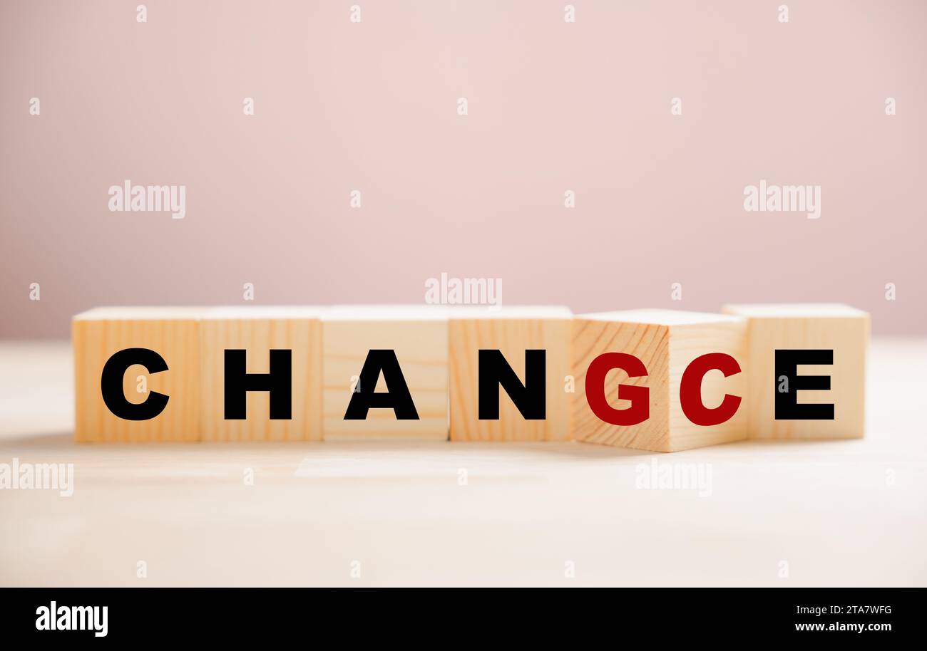 Flipping wooden cube block for Change to Chance Stock Photo - Alamy