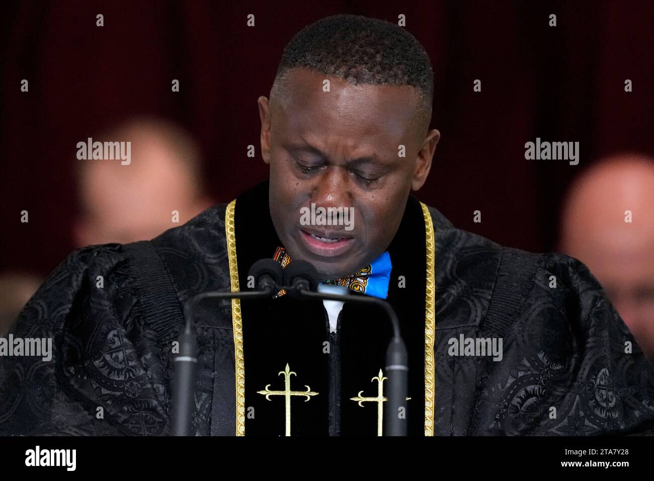 Pastor Tony Lowden cries during a prayer during the funeral service for ...
