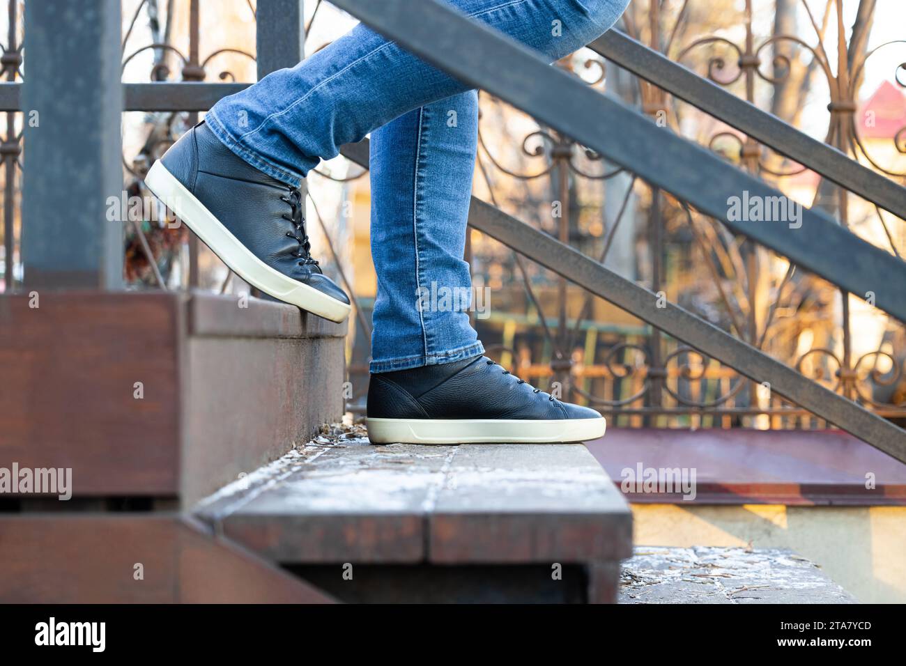 man going down the wooden steps of the stairs Stock Photo - Alamy