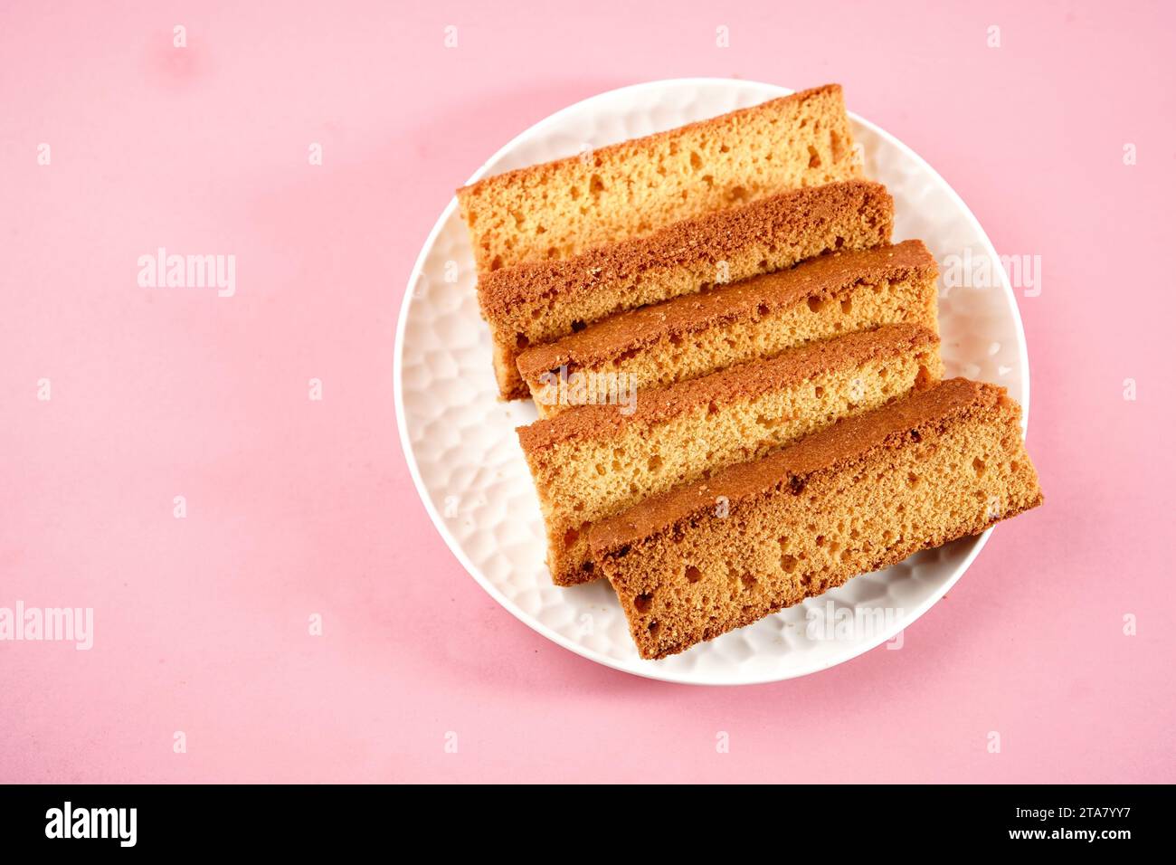 Homemade Indian cake rusk | Dry biscuits isolated on pink background ...