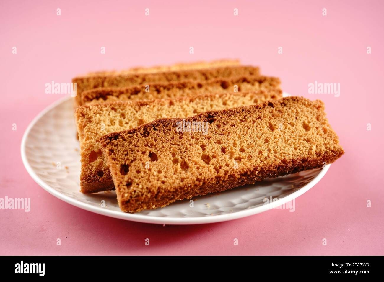 Homemade Indian cake rusk | Dry biscuits isolated on pink background ...