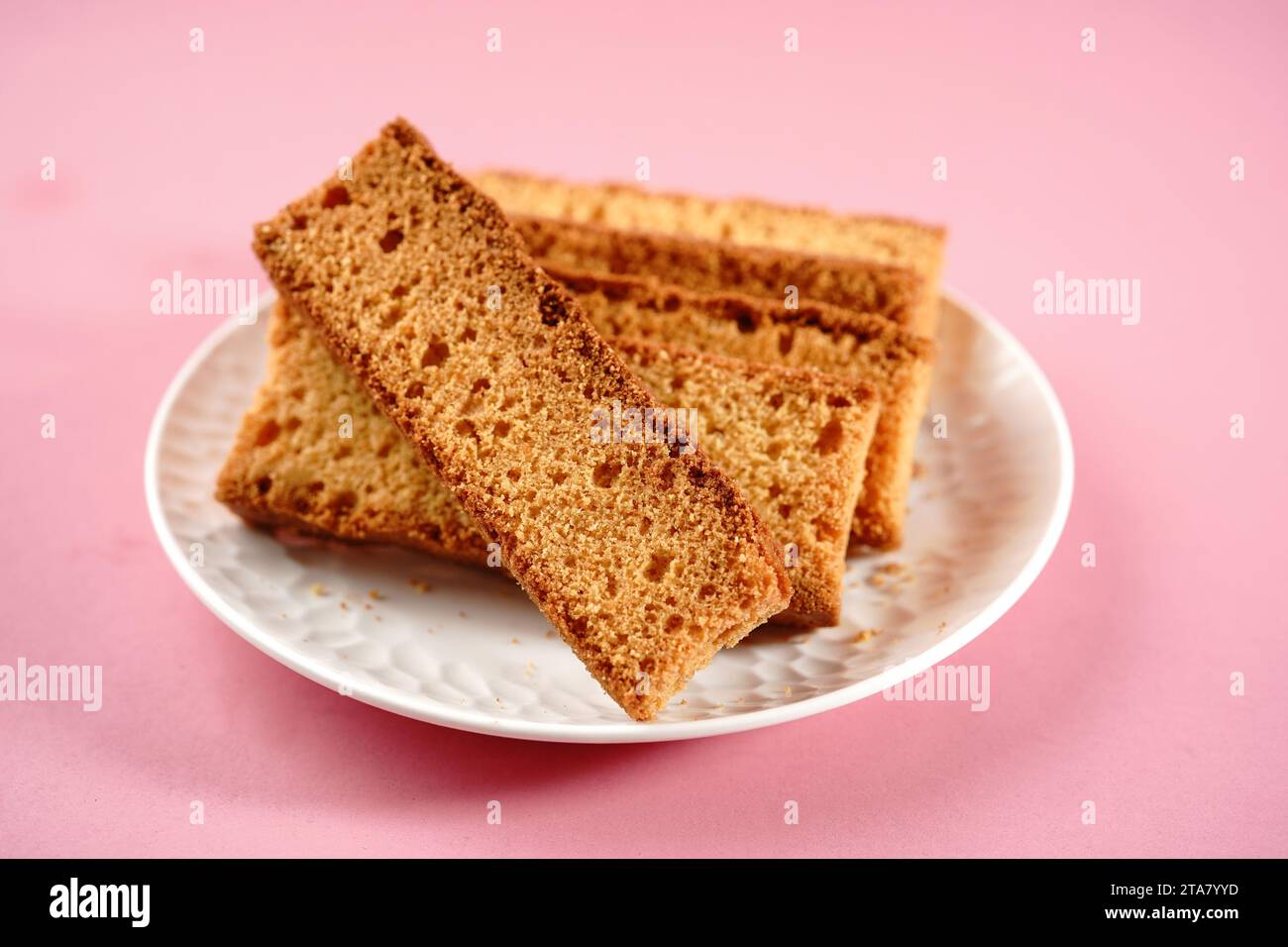 Homemade Indian cake rusk | Dry biscuits isolated on pink background ...