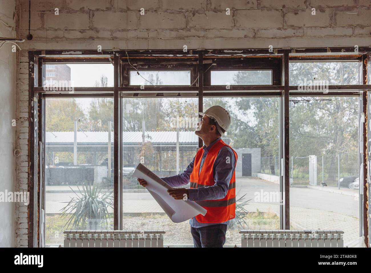 The foreman is assessing the work done and planning the next stages of ...