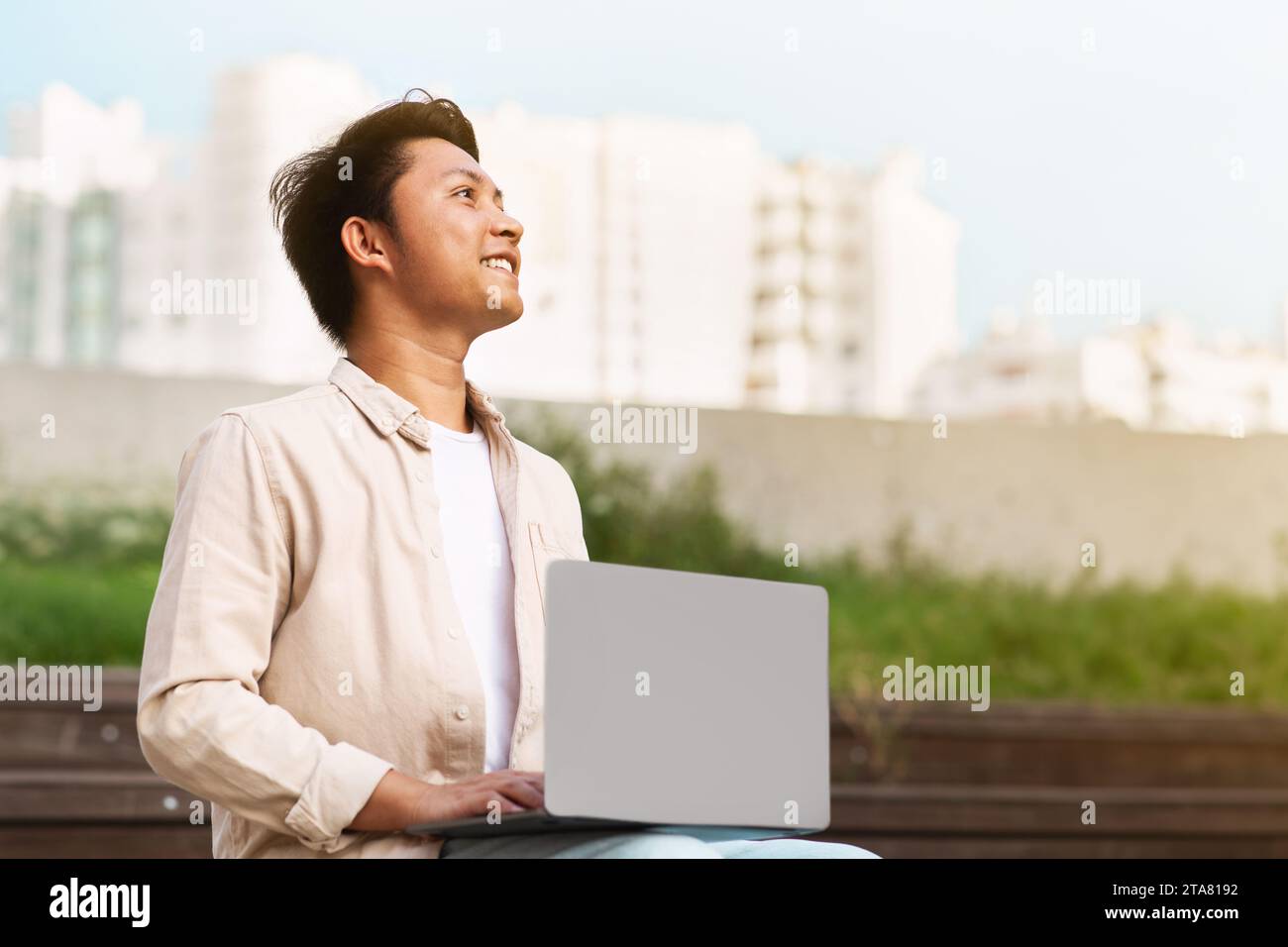 Happy asian korean businessman typing hi-res stock photography and ...