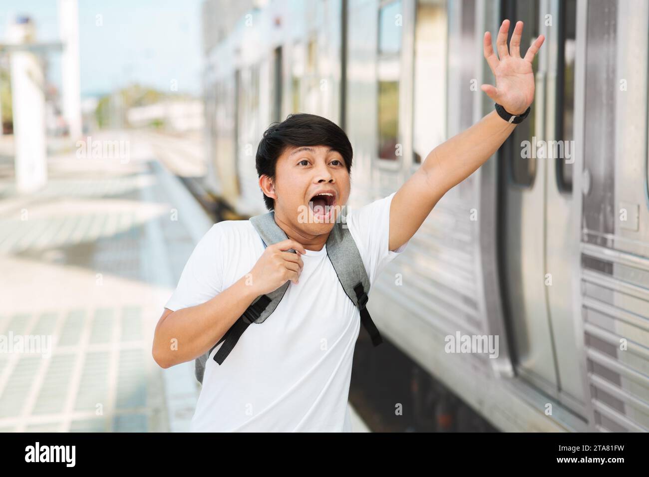 Guy running to catch train hi-res stock photography and images - Alamy