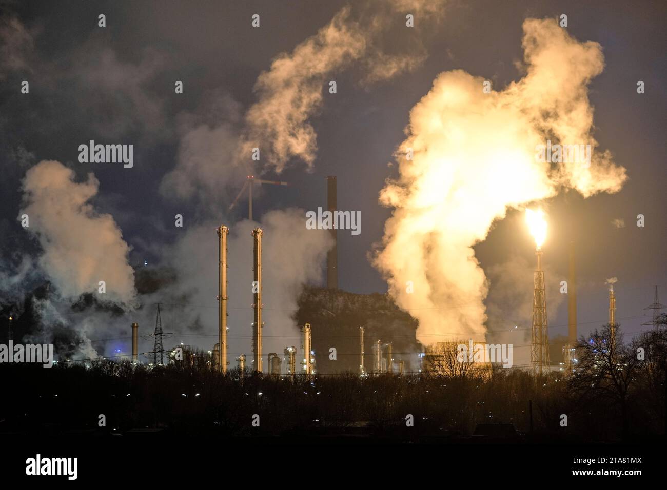 Routine flaring illuminates the night at a BP refinery in Gelsenkirchen ...