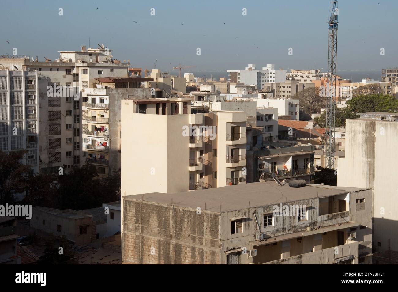 Rooftops at Dusk, Dakar, Senegal. Atlantic Ocean in the distance ...