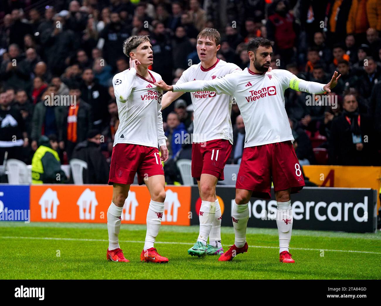 Manchester United's Alejandro Garnacho (left) gestures to his ears as ...