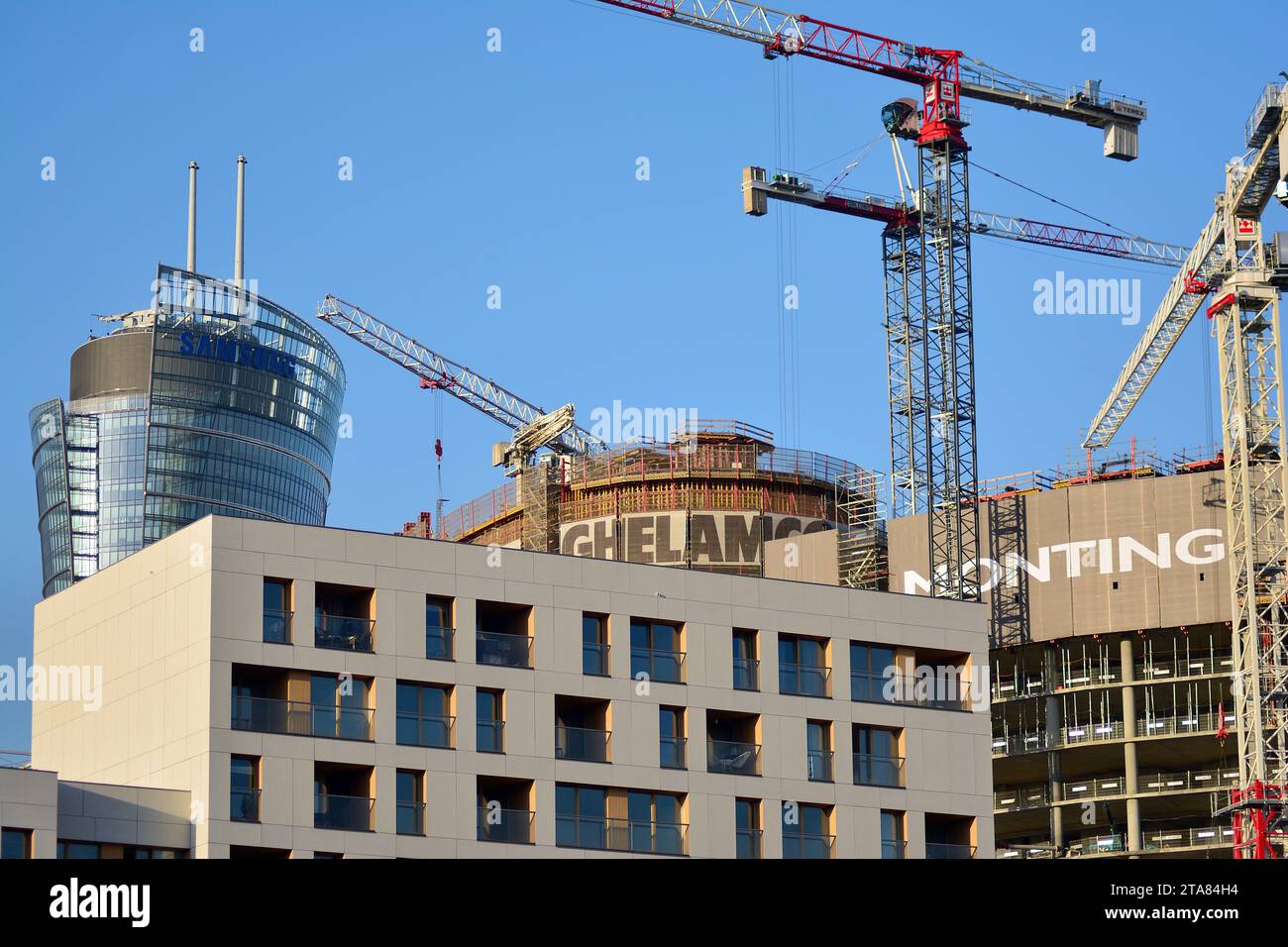 High rise building under construction. Installation of glass facade ...