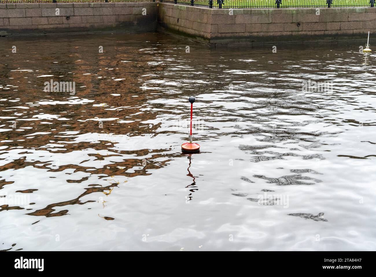 A weathered nautical hanger sign displaying navigational information on ...