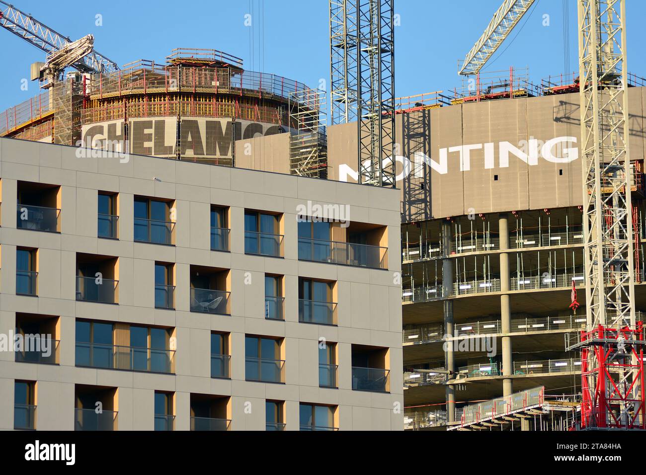 High rise building under construction. Installation of glass facade ...