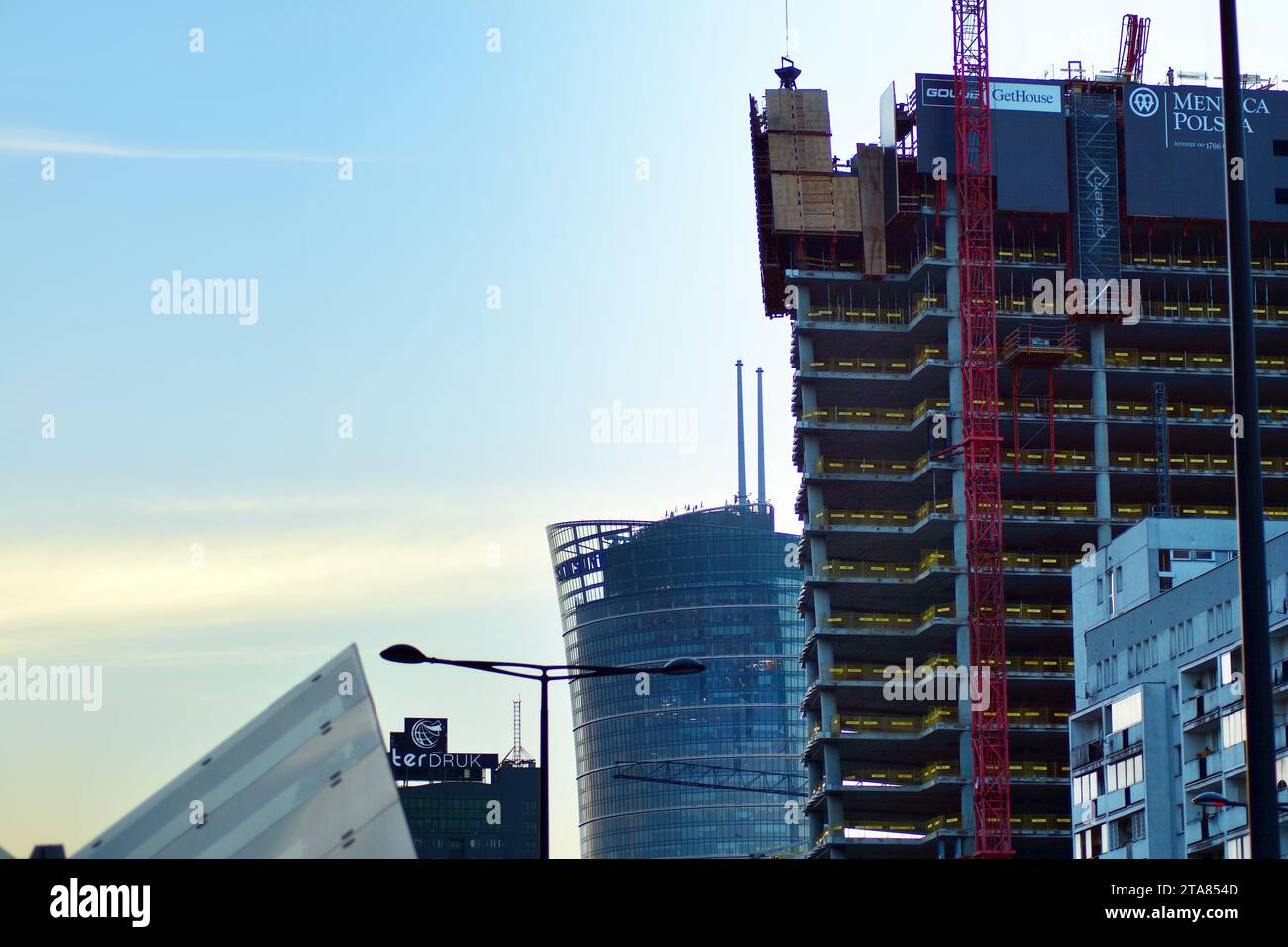 High rise building under construction. Installation of glass facade ...