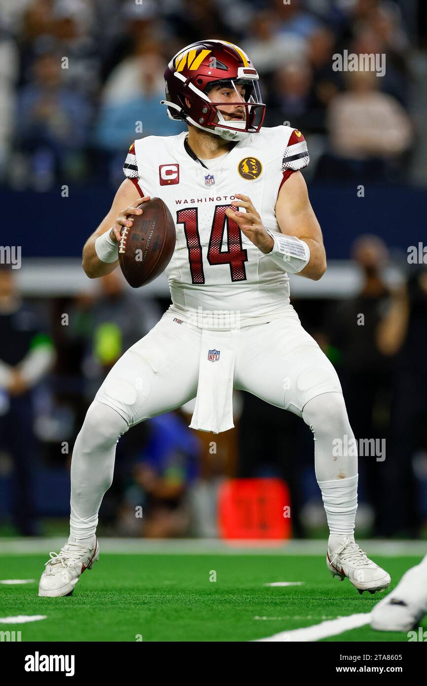 Washington Commanders quarterback Sam Howell #14 drops back to pass during a regular season game ...