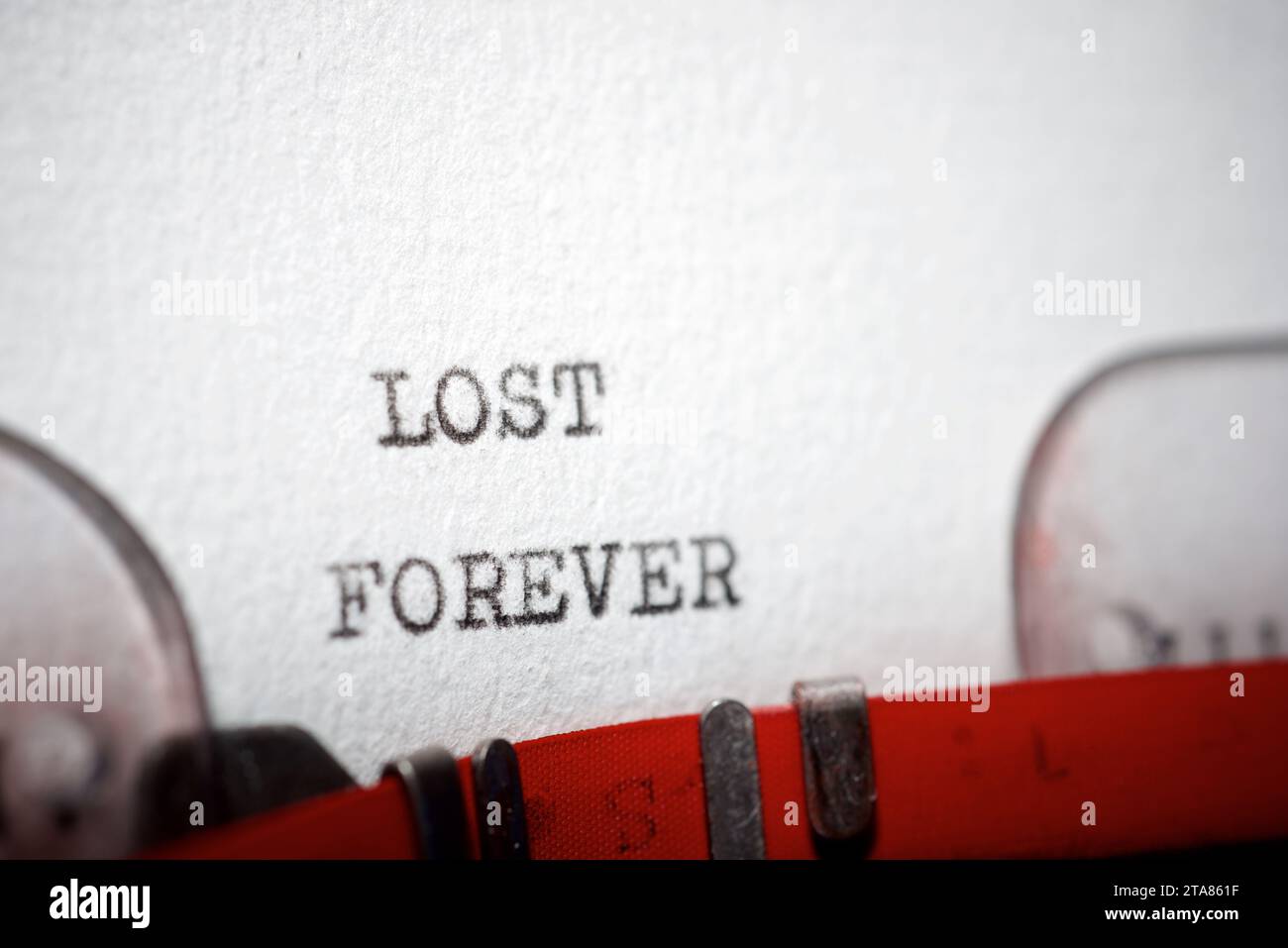 Lost forever text written with a typewriter Stock Photo - Alamy